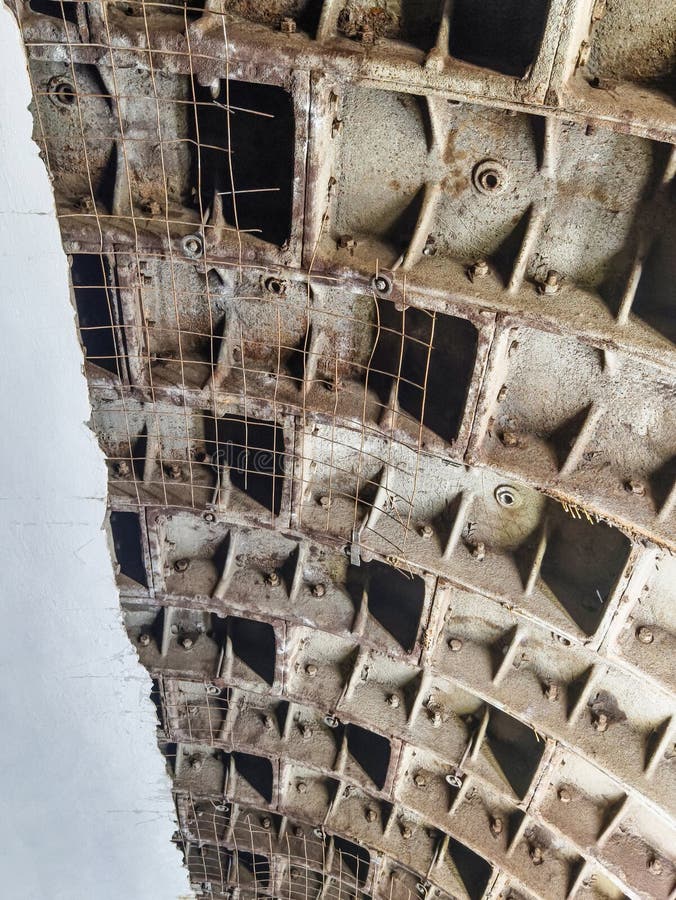 Intricate Concrete Ceiling Structure Exposed during Renovation in Urban ...