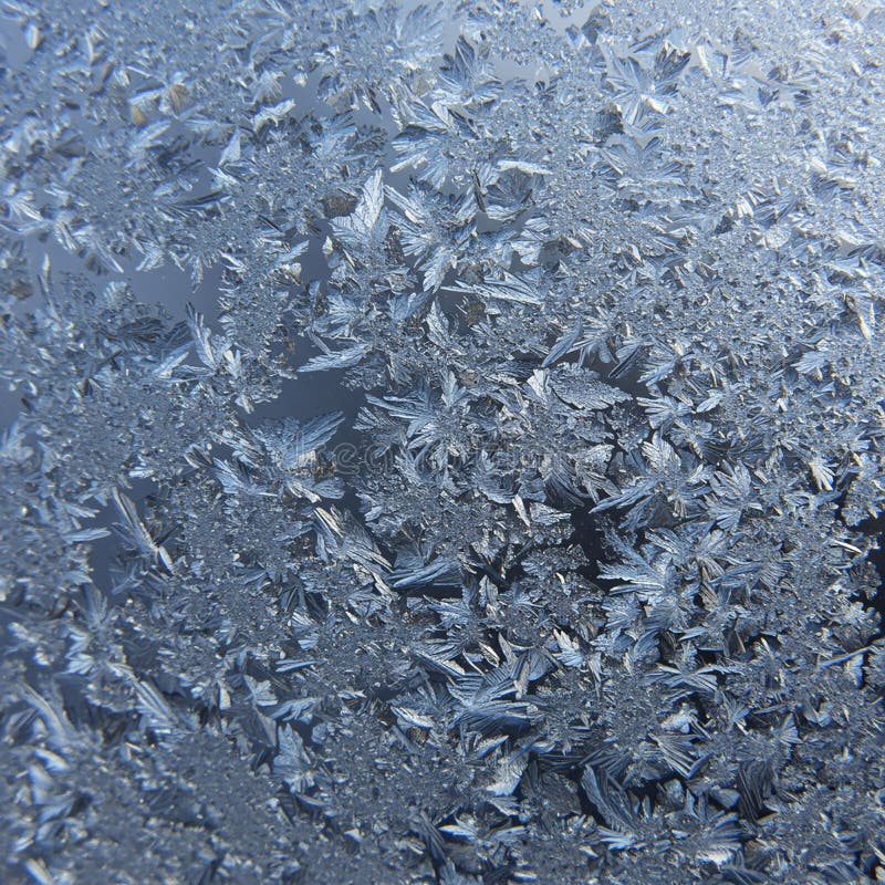 Intricate Ice Crystals Form a Delicate Frost Pattern on a Window. the ...