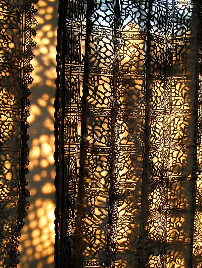 Intricate Lace Curtain with Warm Golden Sunlight Textured Fabric Shadow ...