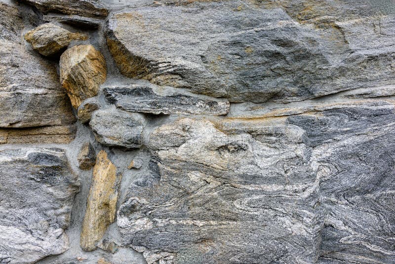 Intricate Layers of Gray and Beige Rocks Showcase Geological Patterns ...