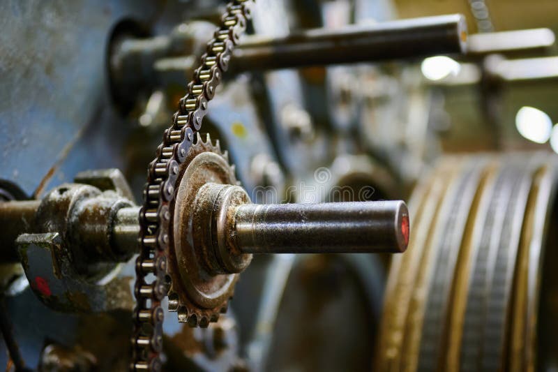 Intricate Machinery Showcasing a Chain and Gear System in a Workshop ...