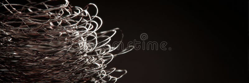 Tangled Wire Mass Expands with Intricate Patterns Against a Shadowed ...