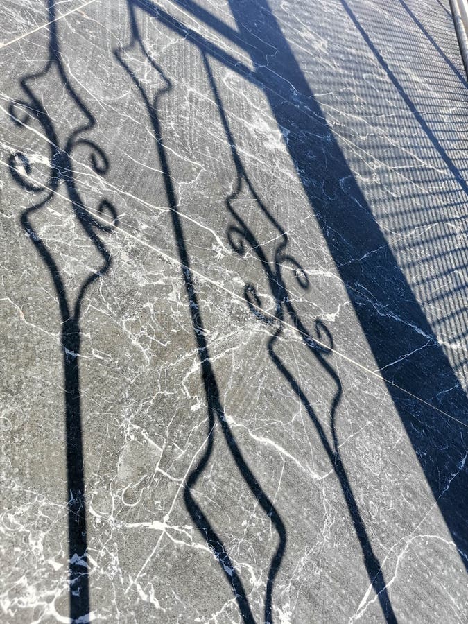 Intricate Shadows Cast on Polished Marble Surface Creating an Artistic ...