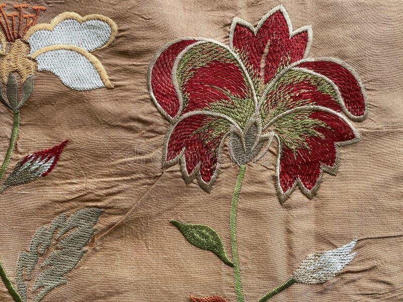 Intricate Silk Thread Embroidered Flower on Beige Silk Fabric Stock ...