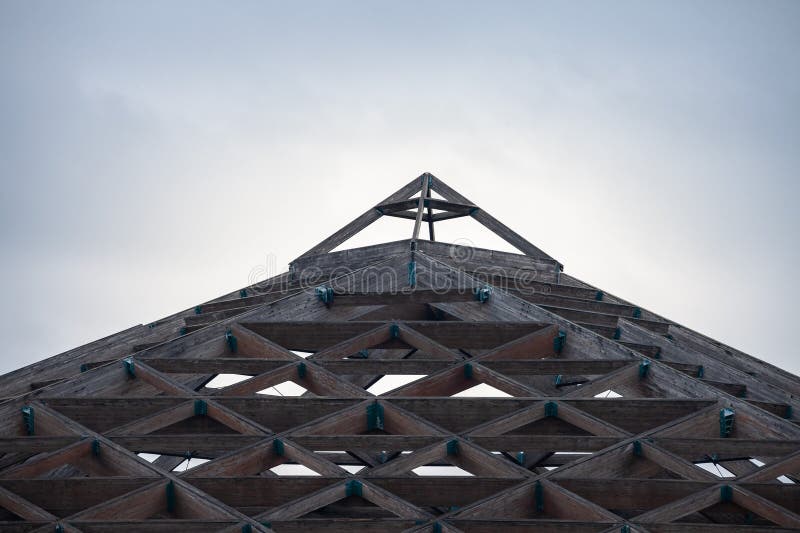 An Intricate Wooden Framework with Triangular Beams Showcases ...