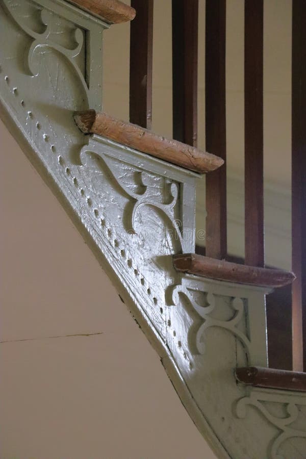 Gray Painted Carved Wood Scroll Staircase Risers Lit by Sun Stock Photo ...
