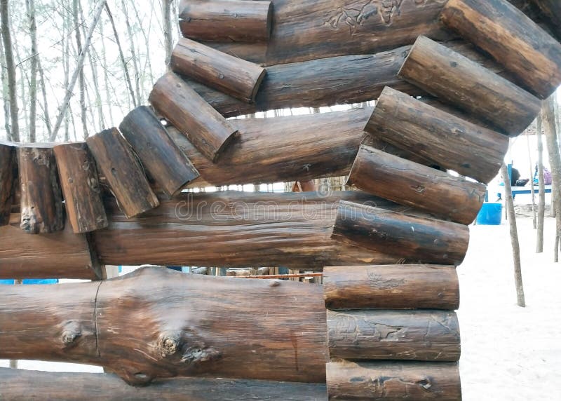 Intricate Wooden Structure Featuring Textured Logs, Ideal for Nature ...