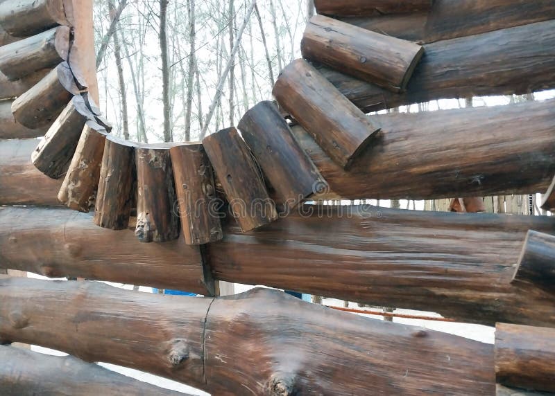 Intricate Wooden Structure Featuring Textured Logs, Ideal for Nature ...
