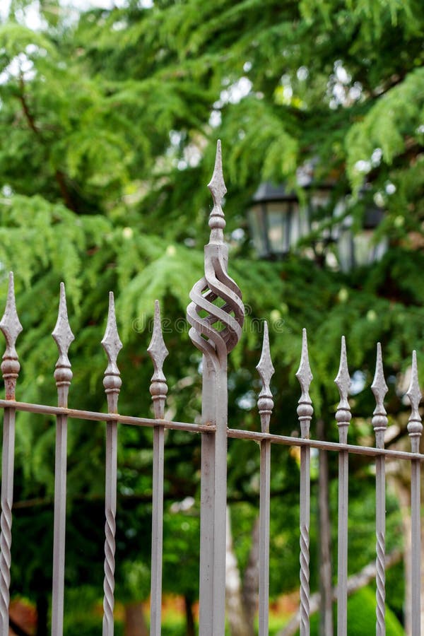 Intricately Designed Iron Fence Post with a Decorative Twisted Pattern ...