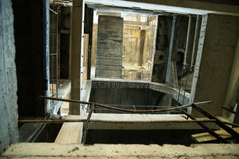 Abandoned Industrial Elevator Shaft with Exposed Concrete and Metal ...