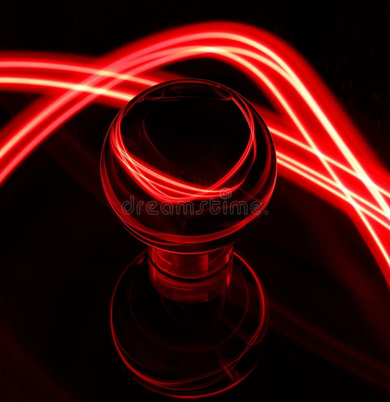 Intriguing Red Light Emanating from a Light Bulb in a Dimly Lit Setting ...