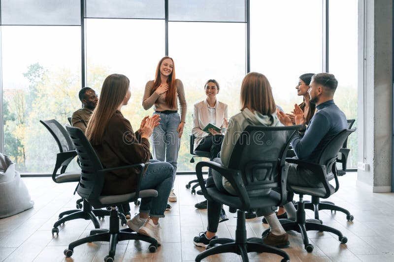 Introducing Herself. Group of People are Having Therapy Meeting ...