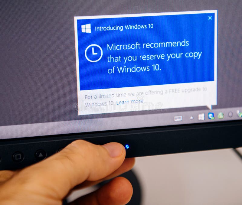 Introducing Windows 10 Message on Computer Display Man Touching ... Introducing Windows 10 Message on Computer Display Man Touching ...