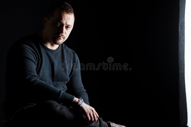 Introspective Male Portrait in Low Light Stock Photo - Image of studio ...