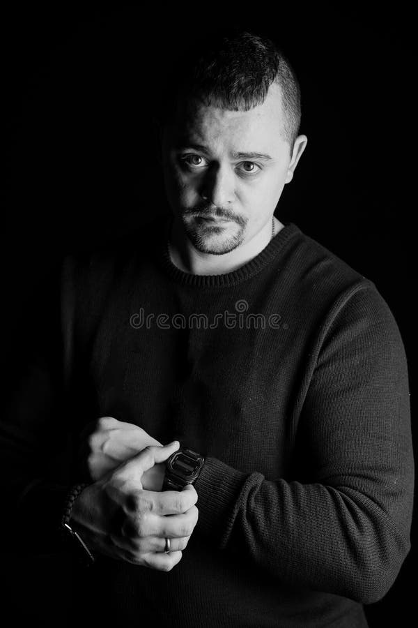 Introspective Man in Dark Mood with Watch Stock Photo - Image of ...