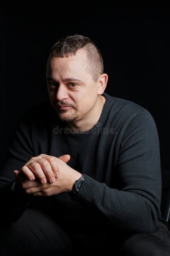 Introspective Man Reflecting Deep Emotions in Shadowy Light Stock Image ...