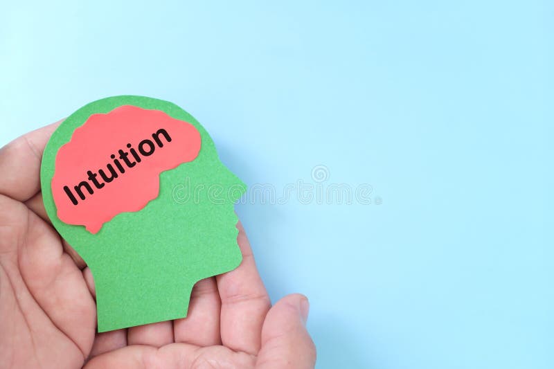 Intuition Concept. Hand Holding Human Head Profile with Word Text on ...
