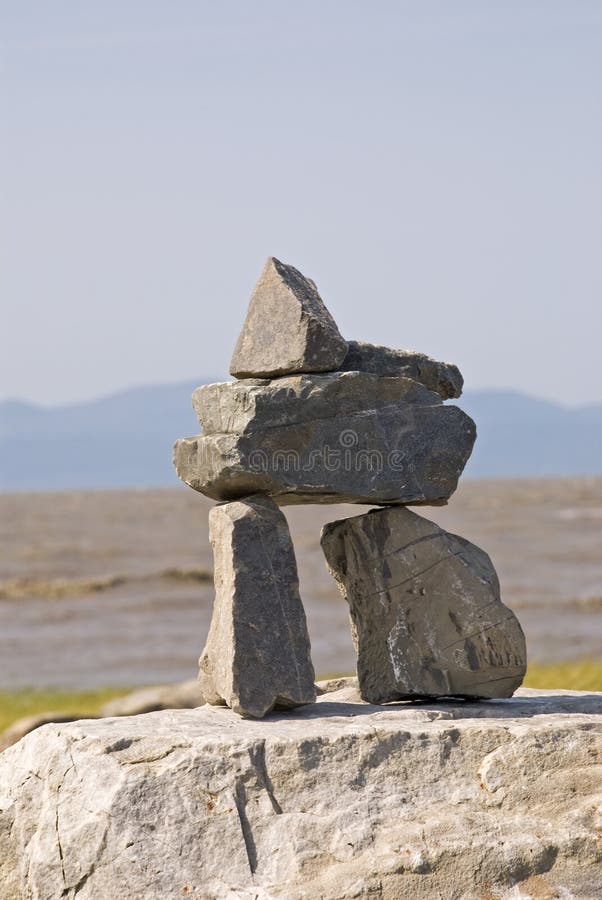 Inukshuk Stone Statue on the Shore at Sunset, Jordan River, BC Stock ...