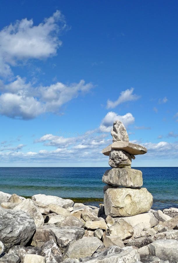 Inuksuk on rocky coast stock photo. Image of coast, spiritual - 11377730