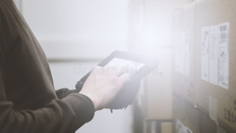 Inventory of the Goods in the Warehouse, Employee with Tablet Checks ...
