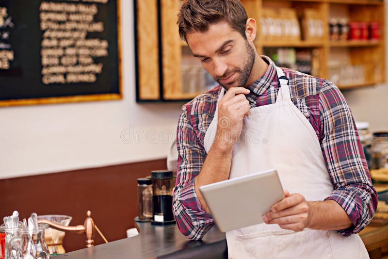 Inventory Made Easy. a Young Barista Using a Digital Tablet in a Cafe ...