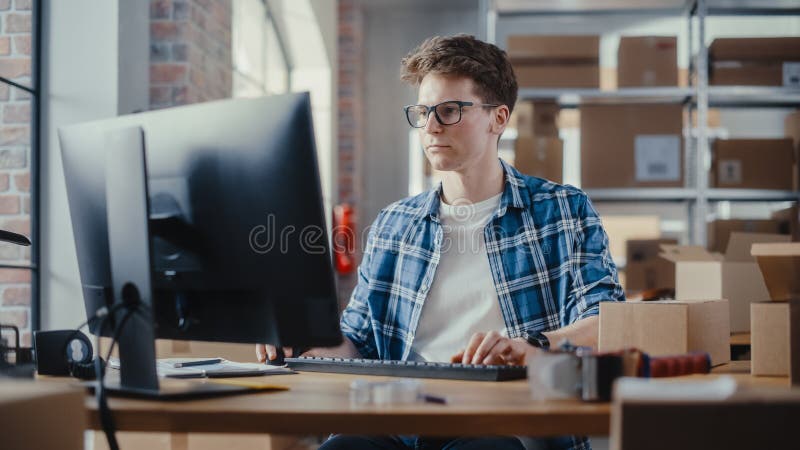 Inventory Manager Using Desktop Computer To Check Order Number on a ...
