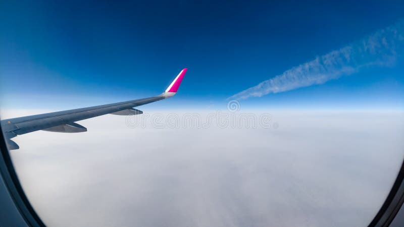 Inversion Trail of an Airplane Above the Clouds Stock Photo - Image of ...