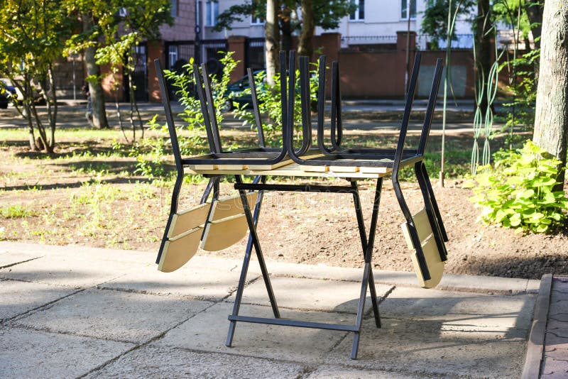 Inverted Chairs on a Table in an Outdoor Cafe Stock Image - Image of ...