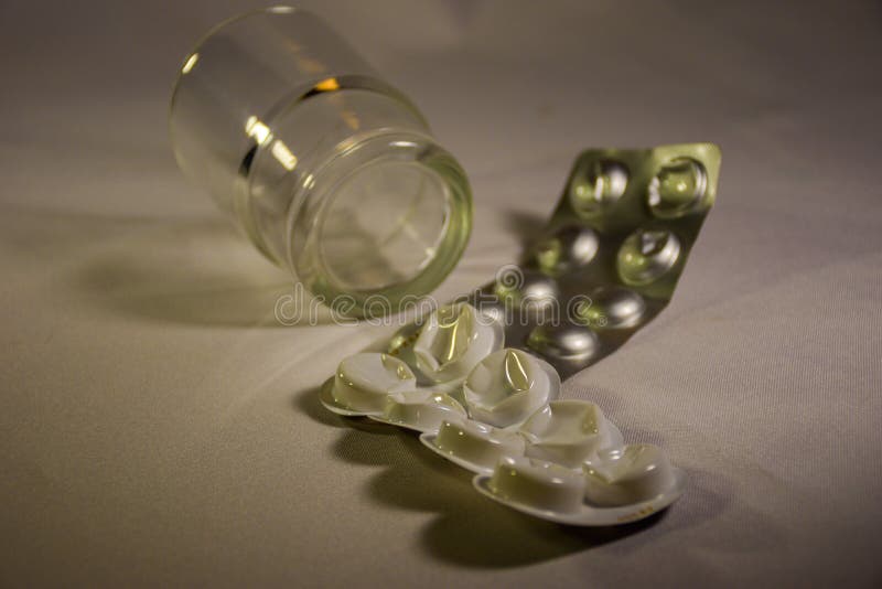 Inverted Glass with Empty Medicine Packaging Stock Photo - Image of ...