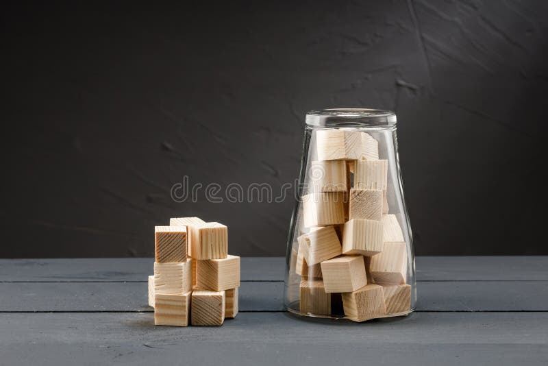 An Inverted Glass Jar in Which There are Wooden Cubes Stock Image ...