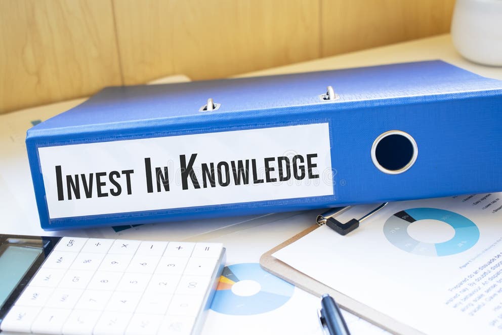 Invest in Knowledge Words on Labels with Document Binders Stock Photo ...