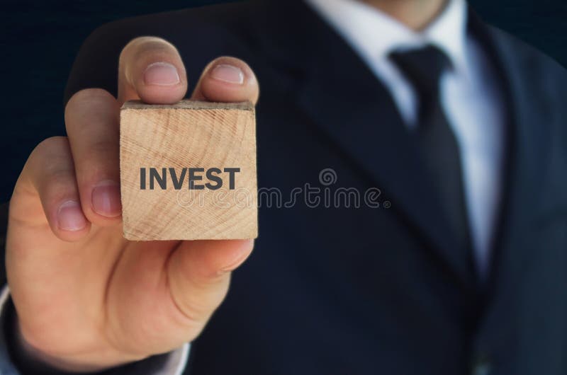 Invest Text on a Wood Cube. Stock Image - Image of message, success ...