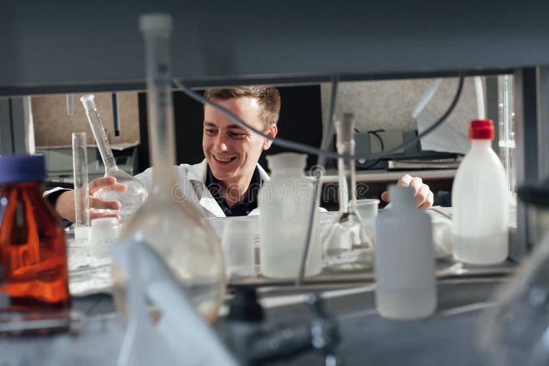 Investigator Checking Test Tubes. Man Wears Protective Goggles and Mask ...