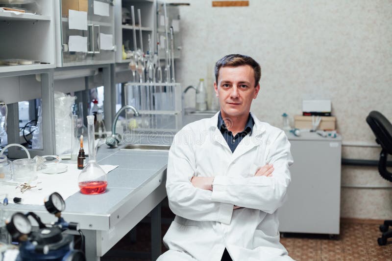 Investigator Checking Test Tubes. Man Wears Protective Goggles and Mask ...