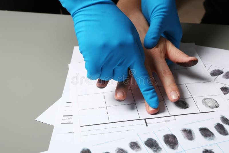 Taking fingerprints stock photo. Image of investigation - 82542438
