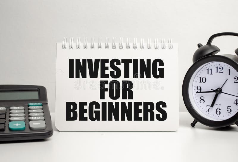 Investing for Beginners Words with Calculator and Clock with Notebook ...