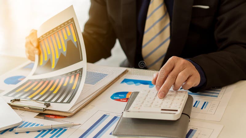 Investors Analyze Financial Reports and Key Performance Indicators. of ... Investors Analyze Financial Reports and Key Performance Indicators. of ...