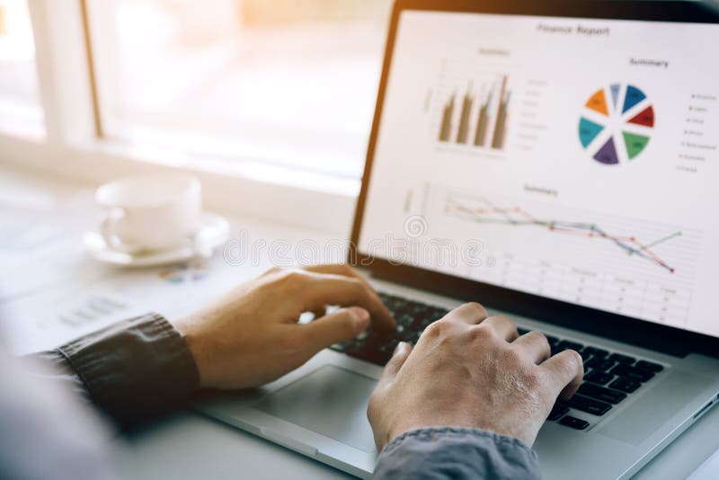 Investors are Using Laptop Computers To Analyze Graphs in the Morning ...