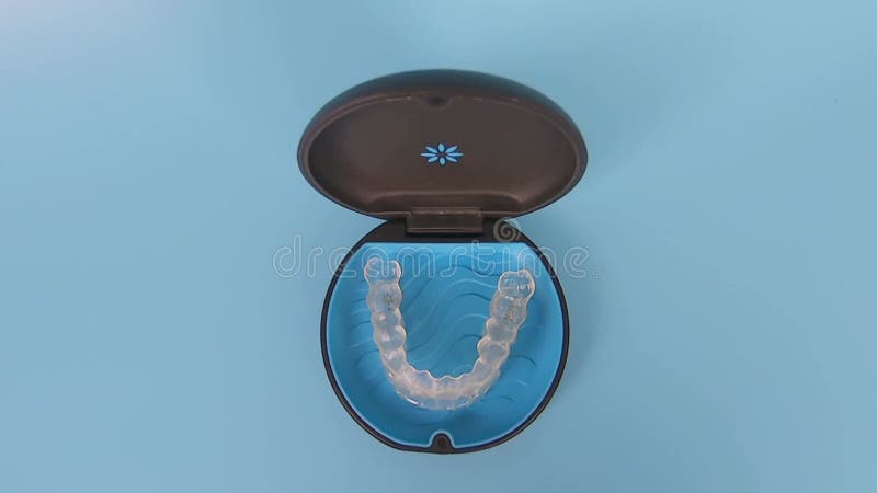 Invisalign Braces or Invisible Transparent Aligner on Blue Background ...