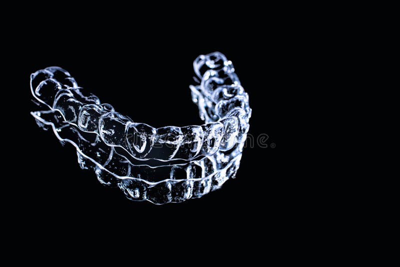 Invisible Aligners Teeth Retainers Lie on the Mirror Stock Photo ...