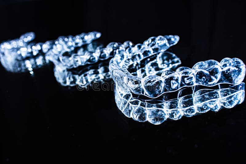 Invisible Aligners Teeth Retainers Lie on the Mirror Stock Image ...