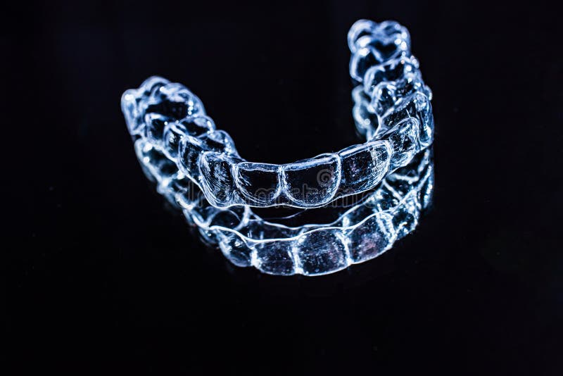 Invisible Aligners Teeth Retainers Lie on the Mirror Stock Image ...