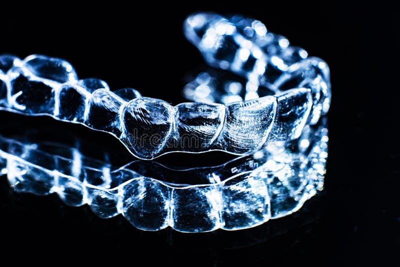 Invisible Aligners Teeth Retainers Lie on the Mirror Stock Image ...