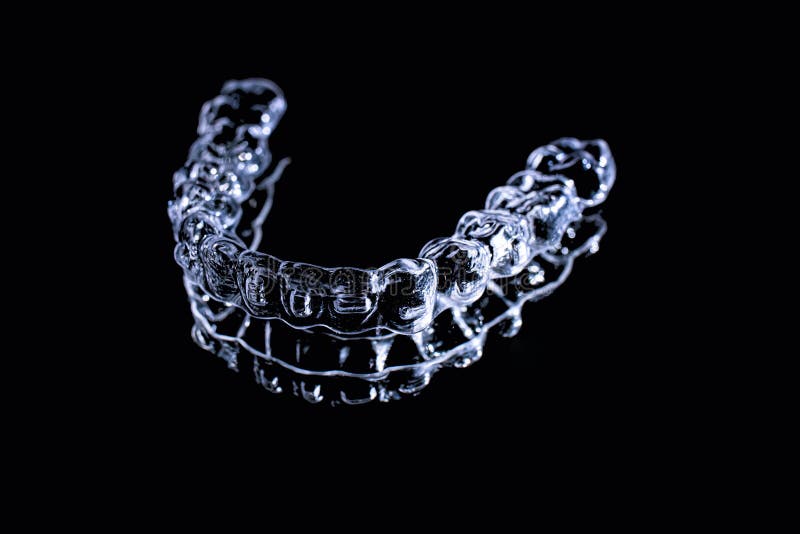 Invisible Aligners Teeth Retainers Lie on the Mirror Stock Image ...