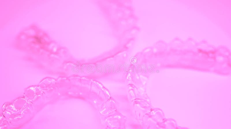 Invisible Dental Braces Teeth Aligners Pink Background. Plastic Braces ...