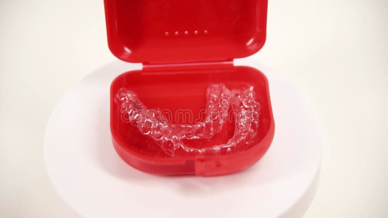 Invisible Dental Braces Teeth Aligners in a Red Container on a White ...
