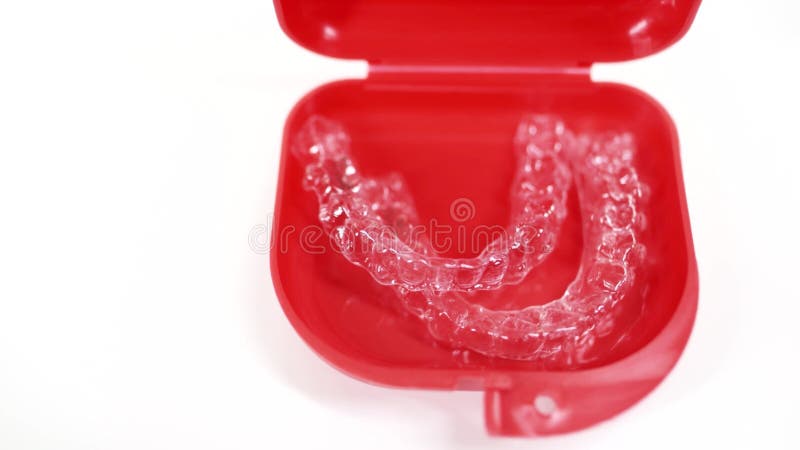 Invisible Dental Braces Teeth Aligners in a Red Container on a White ...