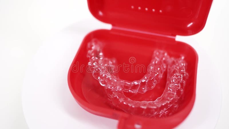 Invisible Dental Braces Teeth Aligners in a Red Container on a White ...