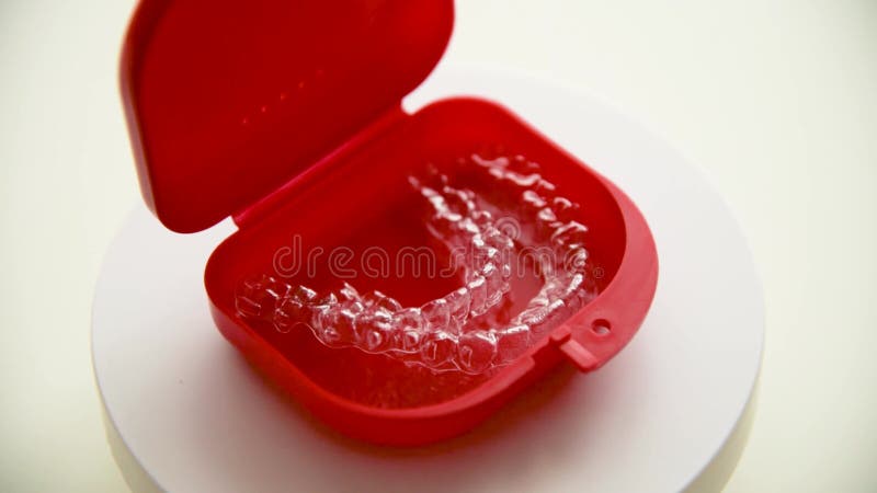 Invisible Dental Braces Teeth Aligners in a Red Container on a White ...