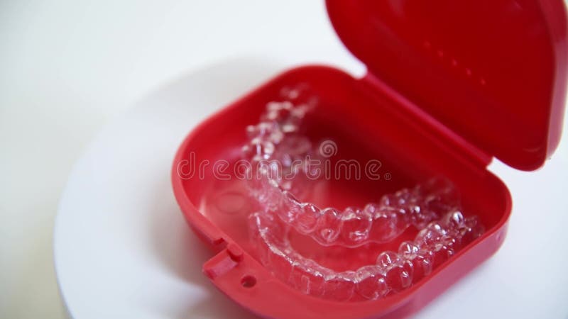 Invisible Dental Braces Teeth Aligners in a Red Container on a White ...
